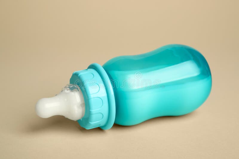 Feeding Bottle with Baby Formula on Beige Background Stock Image ...