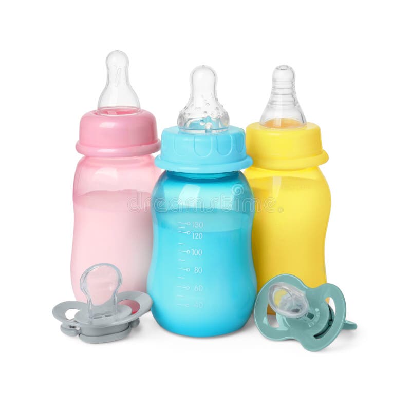 Feeding Bottles with Milk and Pacifiers on White Background Stock Photo ...