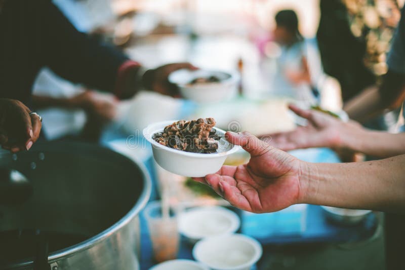 Poverty Concept : Feeding the Poor To Hands of a Beggar Stock Image ...