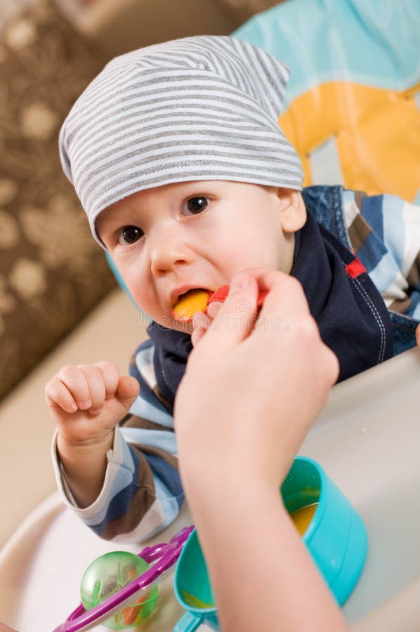 Feeding of a small child stock photo. Image of food, growth - 15230380