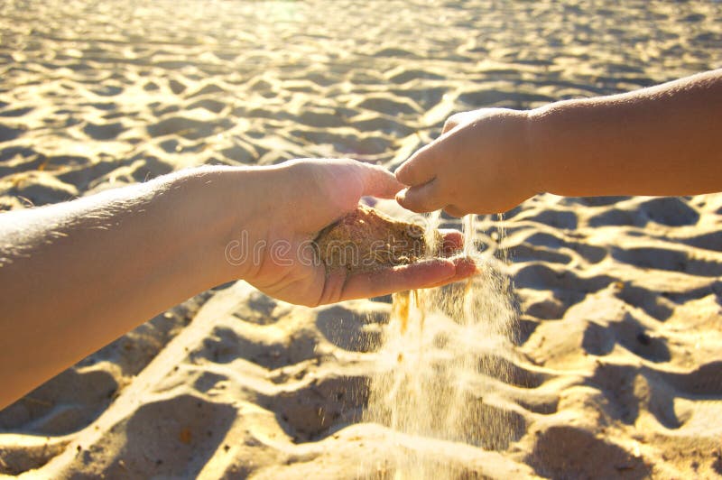 Woman with sand in hands stock image. Image of close - 20727719