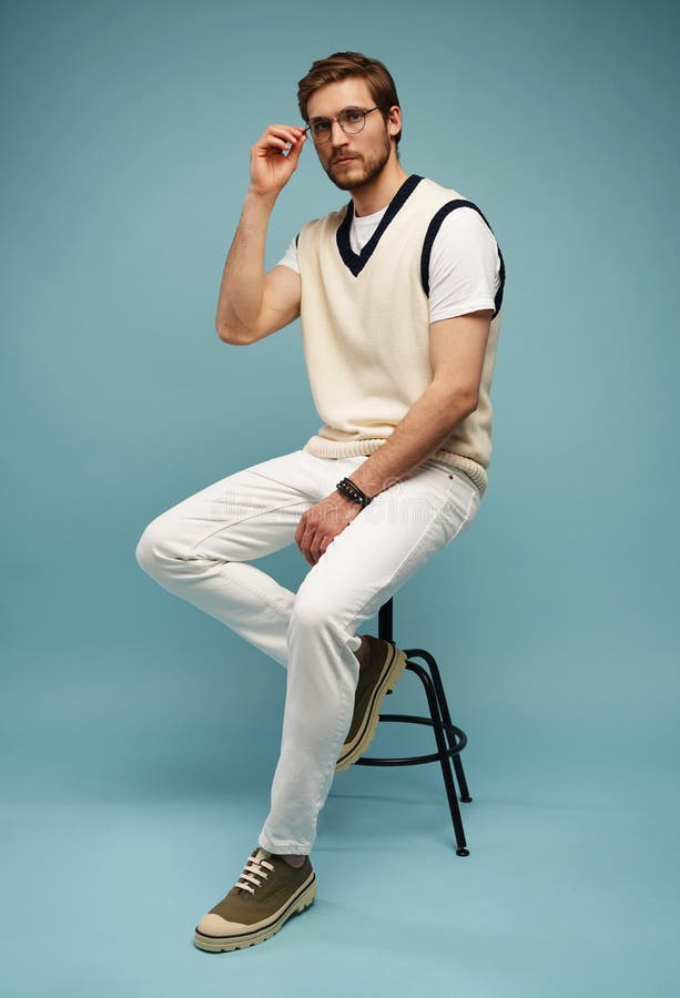 Feeling Comfortable. Joyful Positive Young Man Sitting on a Stool and ...