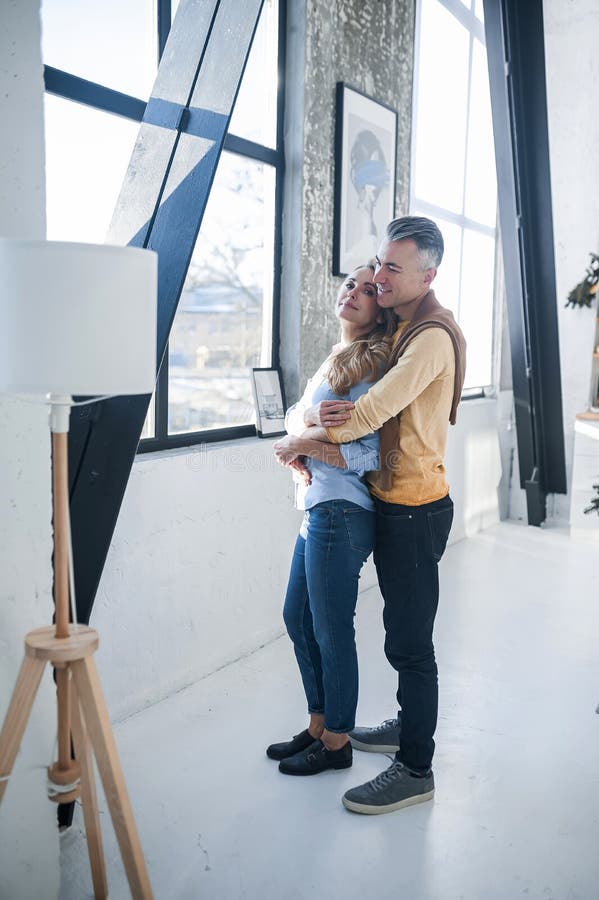 A Happy Couple Standing Together and Hugging Stock Image - Image of ...