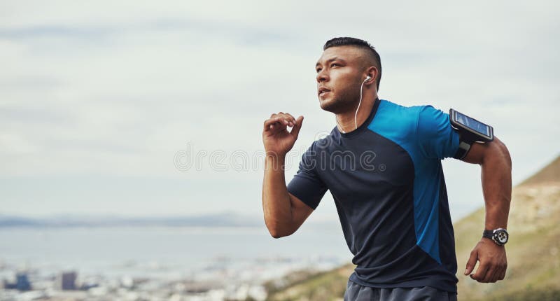Feeling Good and Keeping Fit. a Young Man Running Outdoors. Stock Photo ...