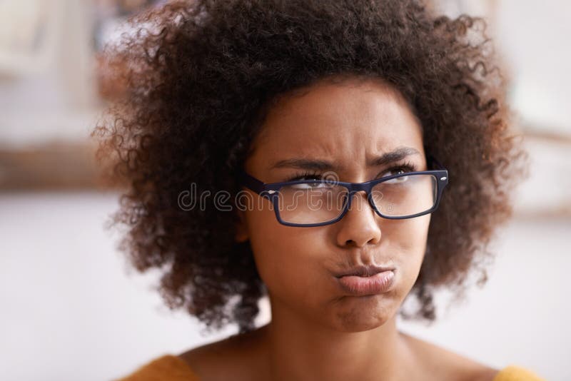 Feeling Silly. an Attractive Young Woman Pouting Jokingly while Looking ...
