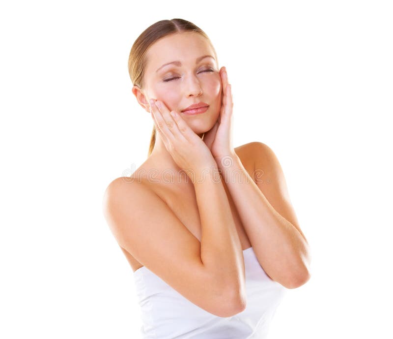 Feeling the Softness. Studio Shot of a Young Model Touching Her Face on ...
