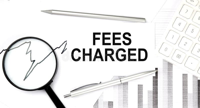 FEES CHARGED Text on Document with Pen,graph and Magnifier,calculator ...