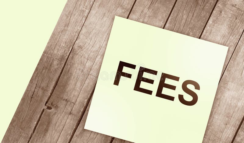 Fees and Charges Written on Paper Against Grey Background. Business ...