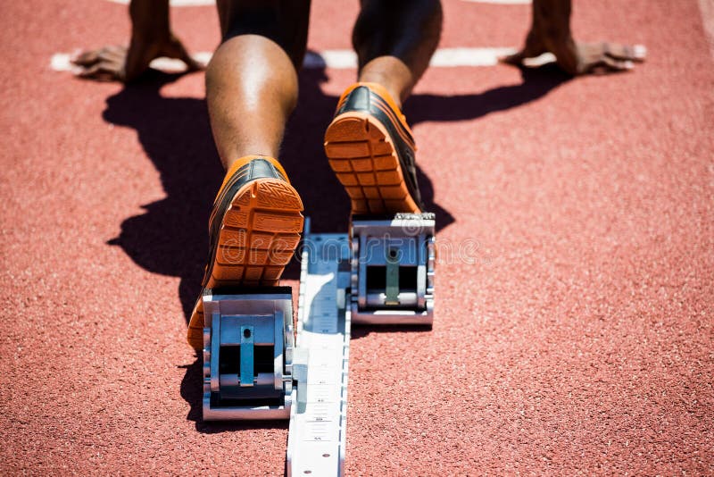 Feet of an Athlete on a Starting Block about To Run Stock Image - Image ...