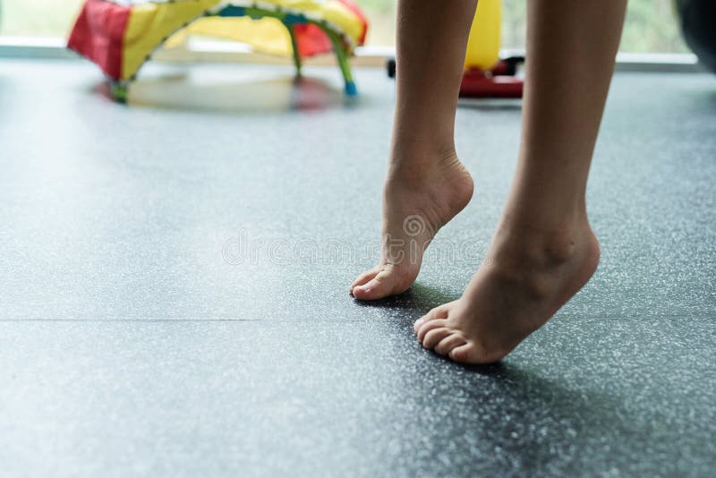 Feet balancing indoors stock image. Image of human, floor - 353916749
