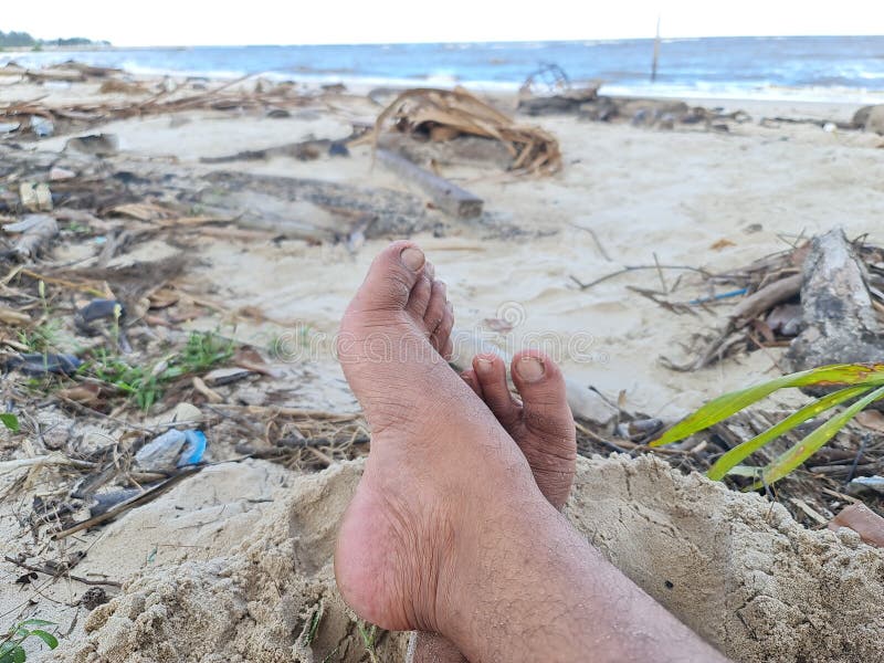 Of Feet on the Beach Full of Trash Stock Photo - Image of wood, person ...