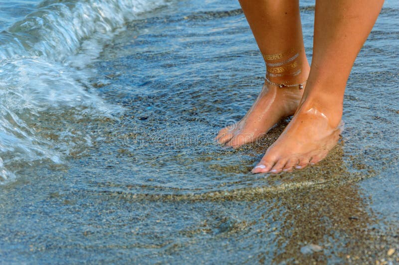 Feet on the beach stock photo. Image of sand, background - 62861578