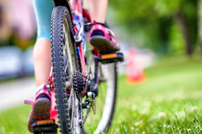 Feet on the bicycle pedals stock image. Image of driving - 269098691