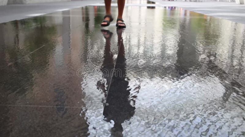 Feet of Boy Going on Flow Water on Floor in Stock Footage - Video of ...