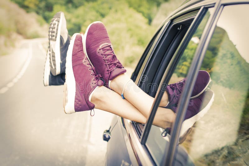 Feet in the car window stock image. Image of lifestyle - 107285163