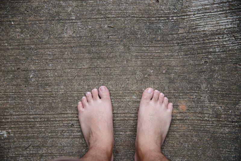 Feet on the cement ground. stock image. Image of cement - 192256969