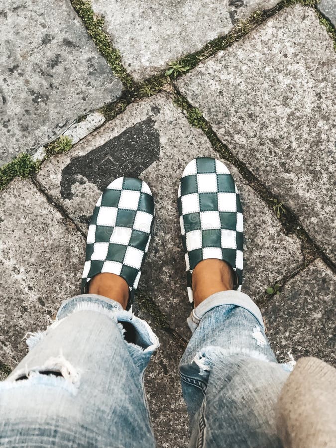 Feet in checkered slippers stock photo. Image of slippers - 170174450