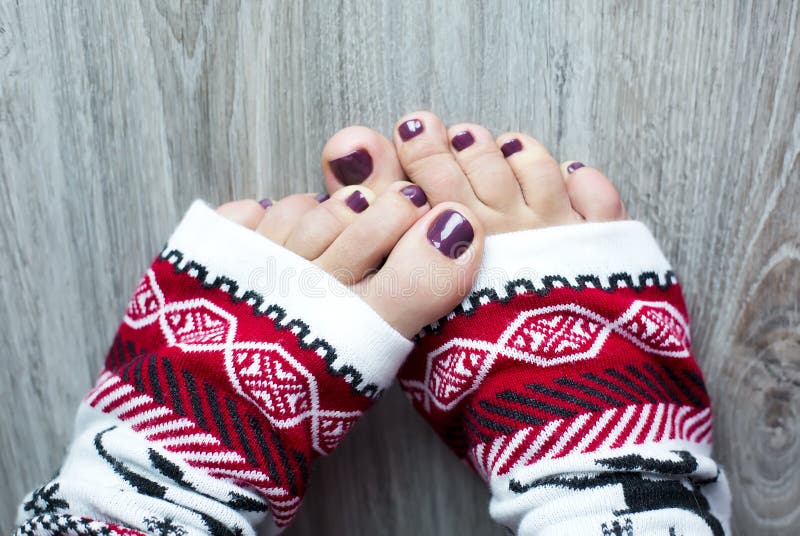 Feet in a christmas socks stock photo. Image of polish - 28381738