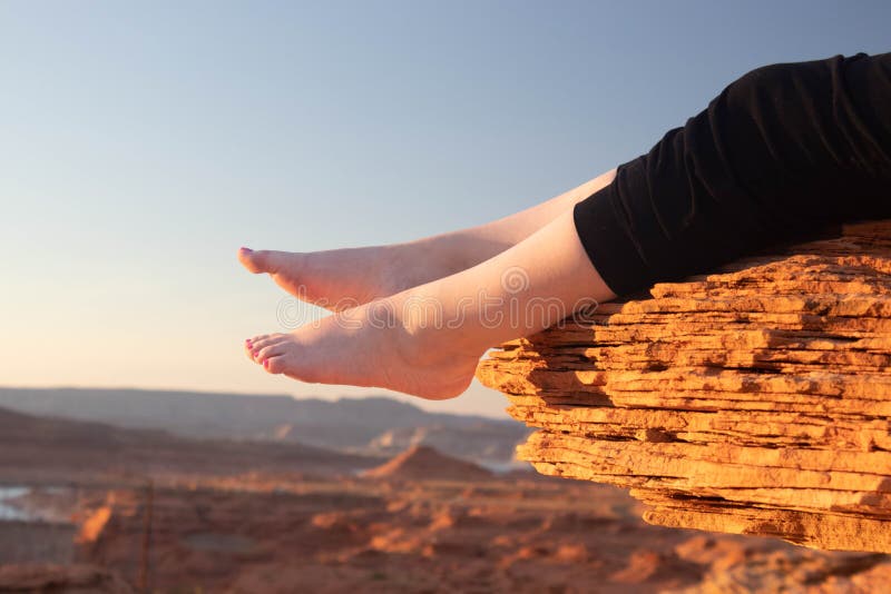 Feet on Cliff at Canyon stock photo. Image of legs, foot - 245383508