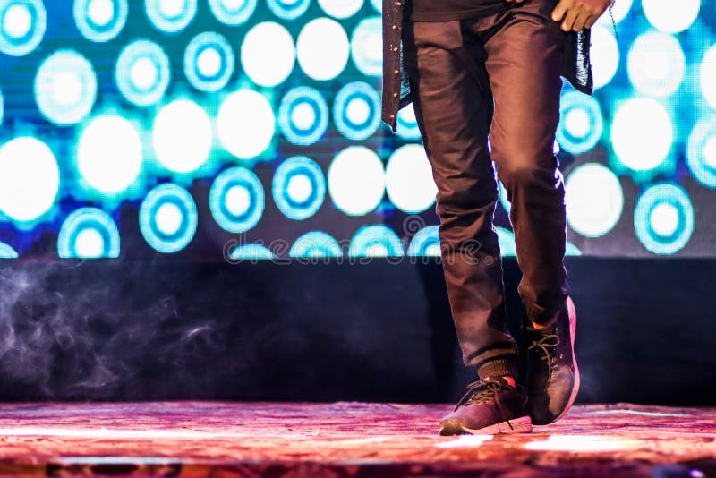 Feet of a Dancer on Stage Doing Hip Hop Dancing Stance with Background ...