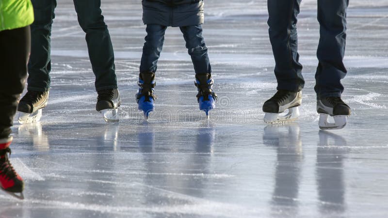 Feet of Different People Skating on the Ice Rink Stock Image - Image of ...