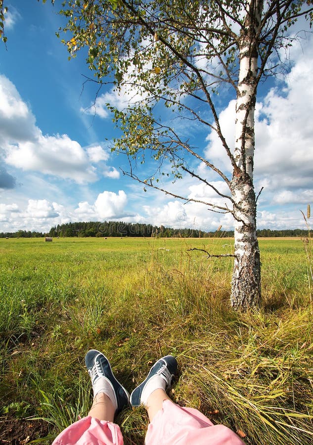 Feet at Field with Beautiful Clouds Stock Image - Image of lying, relax ...