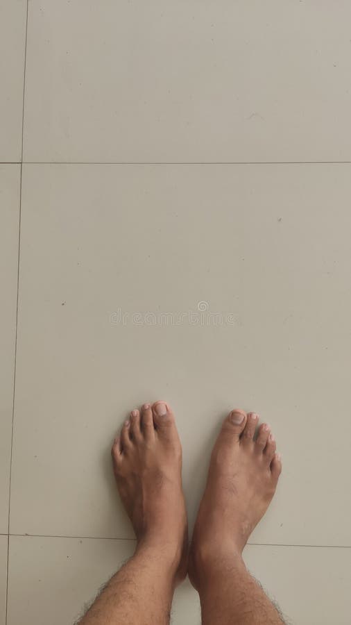 Feet on the floor stock image. Image of nail, floor - 262932471