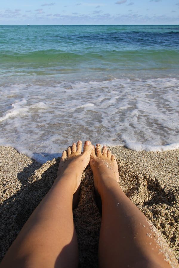 Feet in Florida Sands stock photo. Image of legs, waves - 12057456