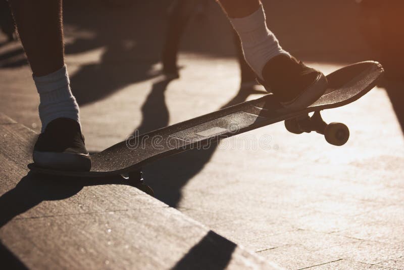 Feet of guy on skateboard. stock image. Image of skateboard - 78994231