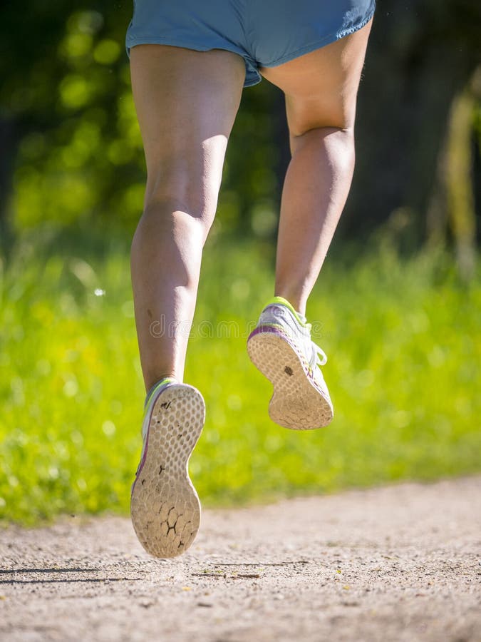 Feet of a jogger stock photo. Image of training, road - 92892954