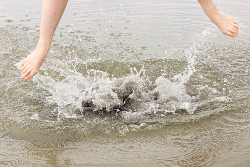 Feet Jumping in the Water on the Lake Shore Stock Image - Image of ...
