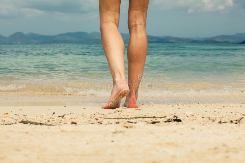 Feet and Legs of Young Woman Walking on Beach Stock Photo - Image of ... Feet and Legs of Young Woman Walking on Beach Stock Photo - Image of ...