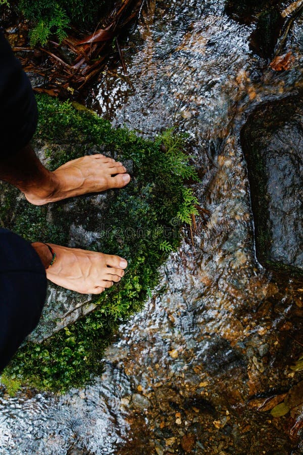 Feet of Man without Shoes Standing on Wet Rock of River Stock Photo ...