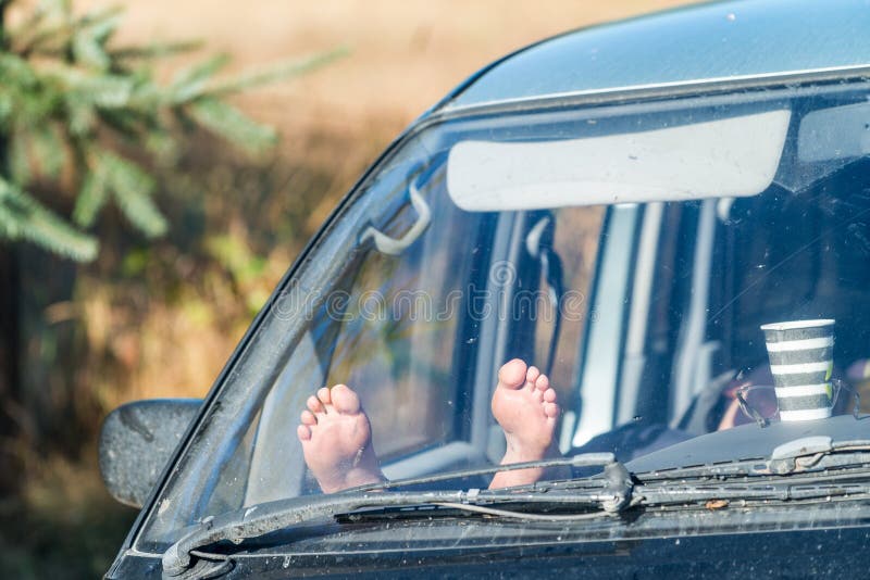 Feet of Man Sleeping in the Car Stock Photo - Image of transportation ...