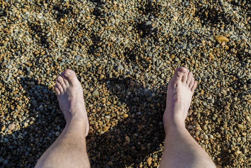 The Feet of a Man on Small Stones. Stock Photo - Image of lifestyle ...