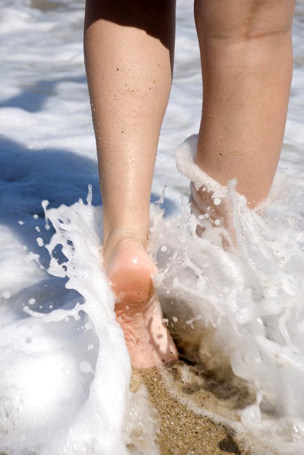 Feet in the ocean surf stock photo. Image of foamy, north - 1182744
