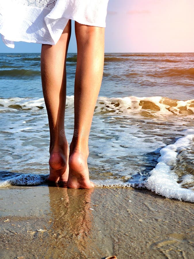 Feet in the ocean foam stock photo. Image of beach, photograph - 238812250