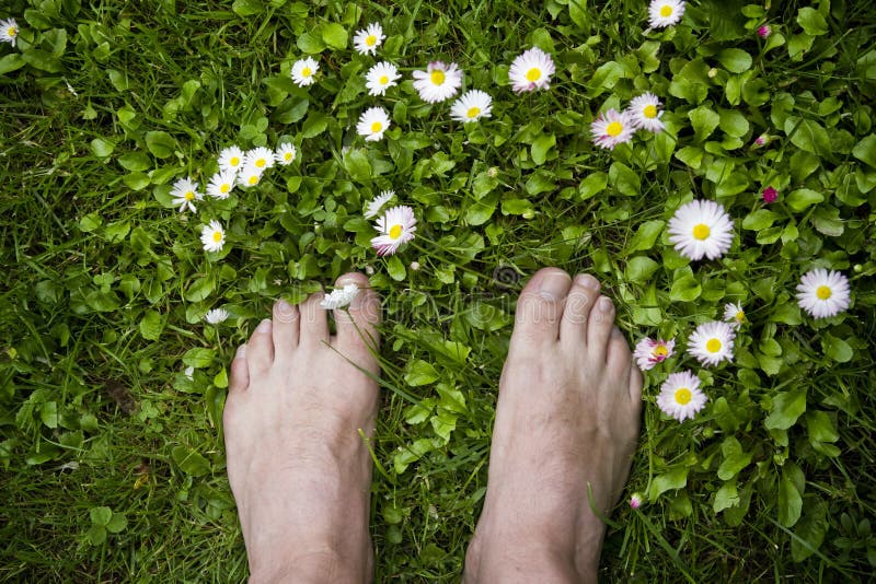 Woman Resting Her Feet in the Grass Stock Photo - Image of relaxation ...