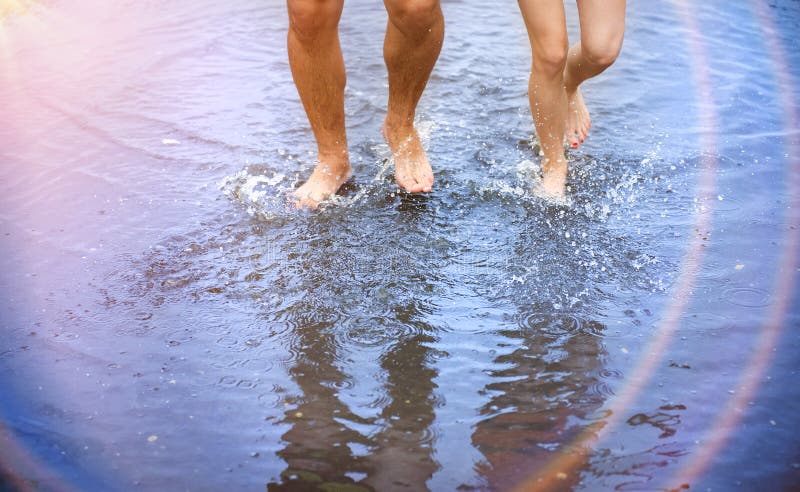 Feet in puddle stock photo. Image of friends, shower - 53116174