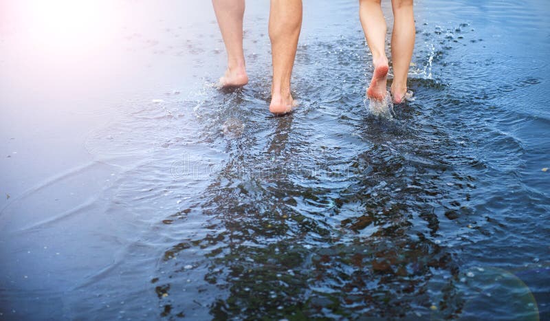 Feet in puddle stock photo. Image of spring, bare, rain - 53136420