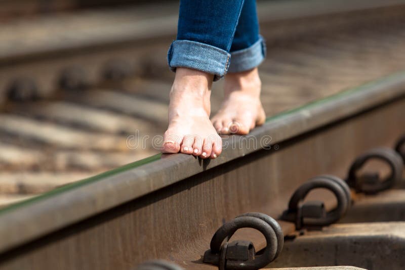 Barefoot girl goes by rail stock image. Image of girl - 32884277