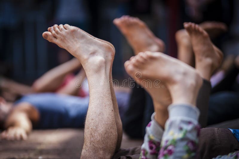Raised Feet Putting on To Rollerblades Against a Blue Sky Stock Image ...