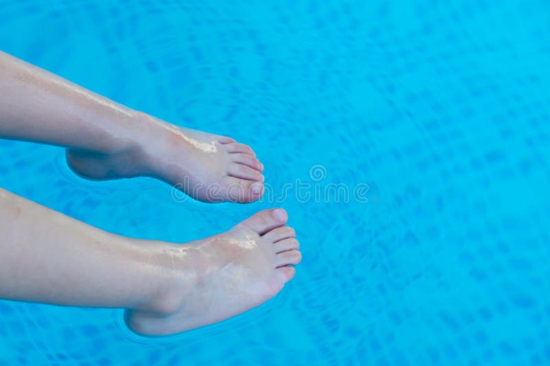 Feet by the swimming pool stock image. Image of prints - 5854135