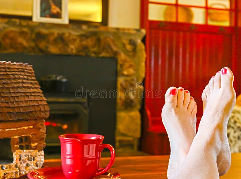Feet Resting by the Fire with a Cup of Tea Stock Image - Image of steam ...
