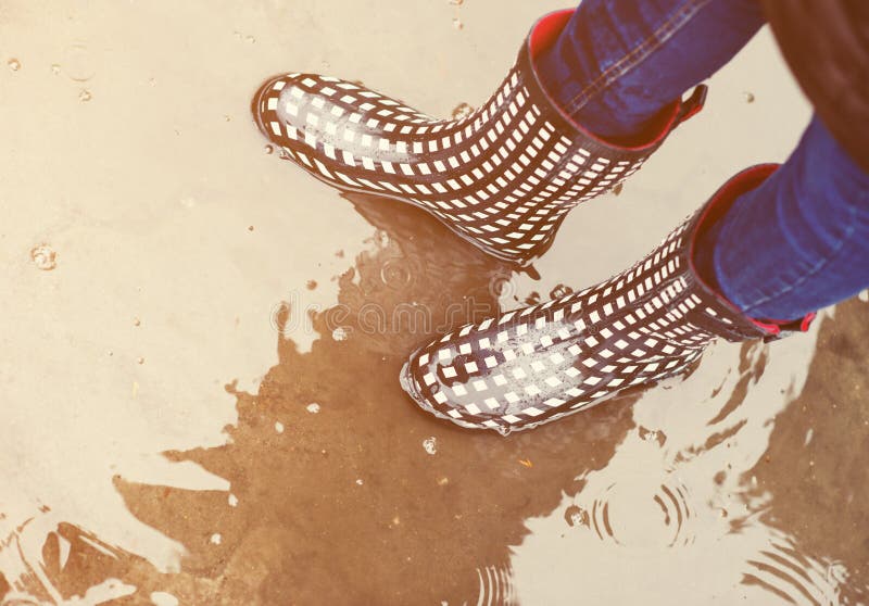 Feet in Rubber Boots in Puddle Stock Photo - Image of spring, rainboots ...