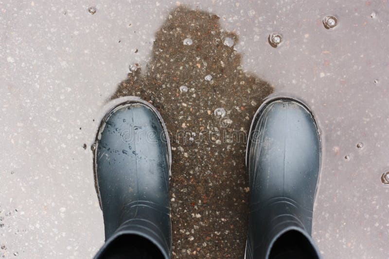 Feet in Rubber Boots in a Puddle Stock Image - Image of village, street ...