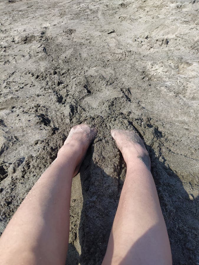 Feet s and legs on sand stock photo. Image of piernas - 171749244