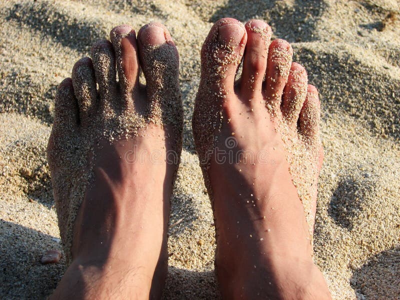 Feet in the sand stock photo. Image of covered, feet, beach - 2773148