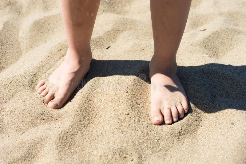 Feet in the sand stock photo. Image of texture, beach - 116299772