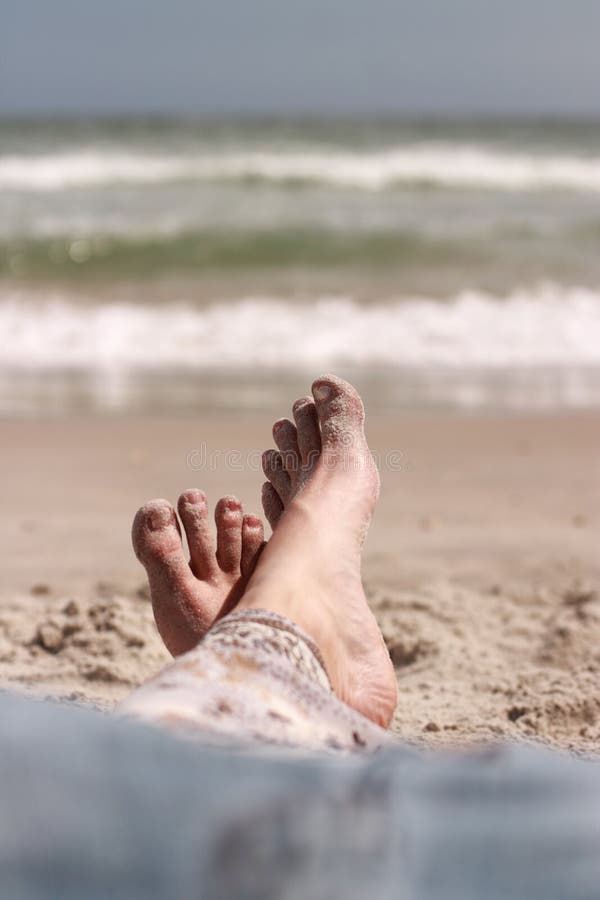 Feet on the sand stock photo. Image of coast, sand, waves - 59047488